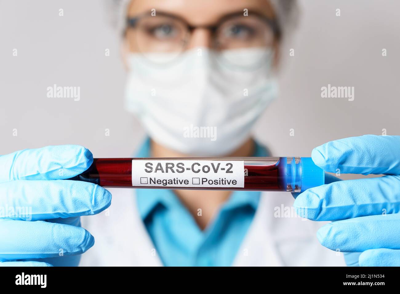 Female doctor is holding a blood sample of the SARS-CoV-2 Stock Photo ...