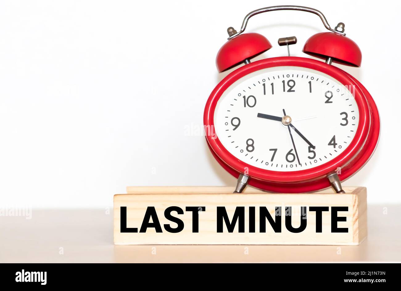 Last Minute Alarm Clock In Sand On Tropical Beach Stock Photo - Alamy