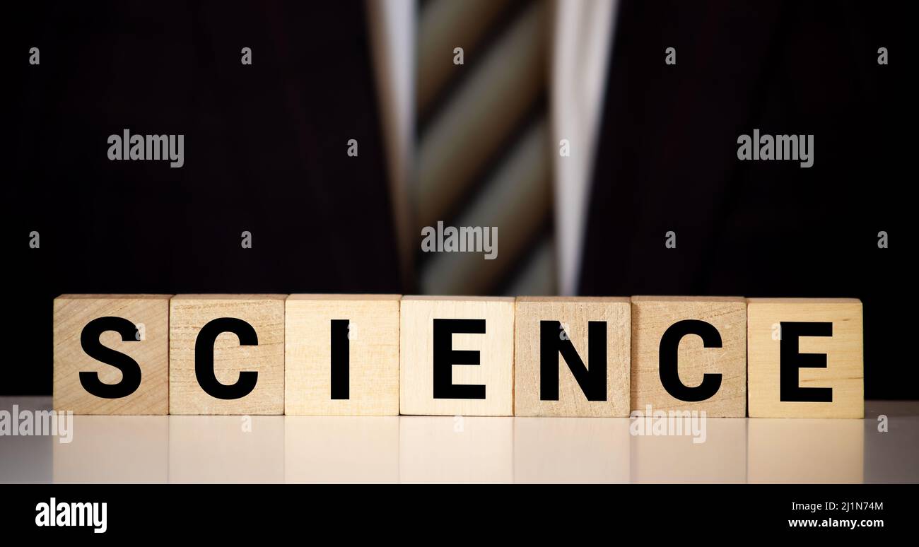 science word written on wood block. science text on cement table for ...
