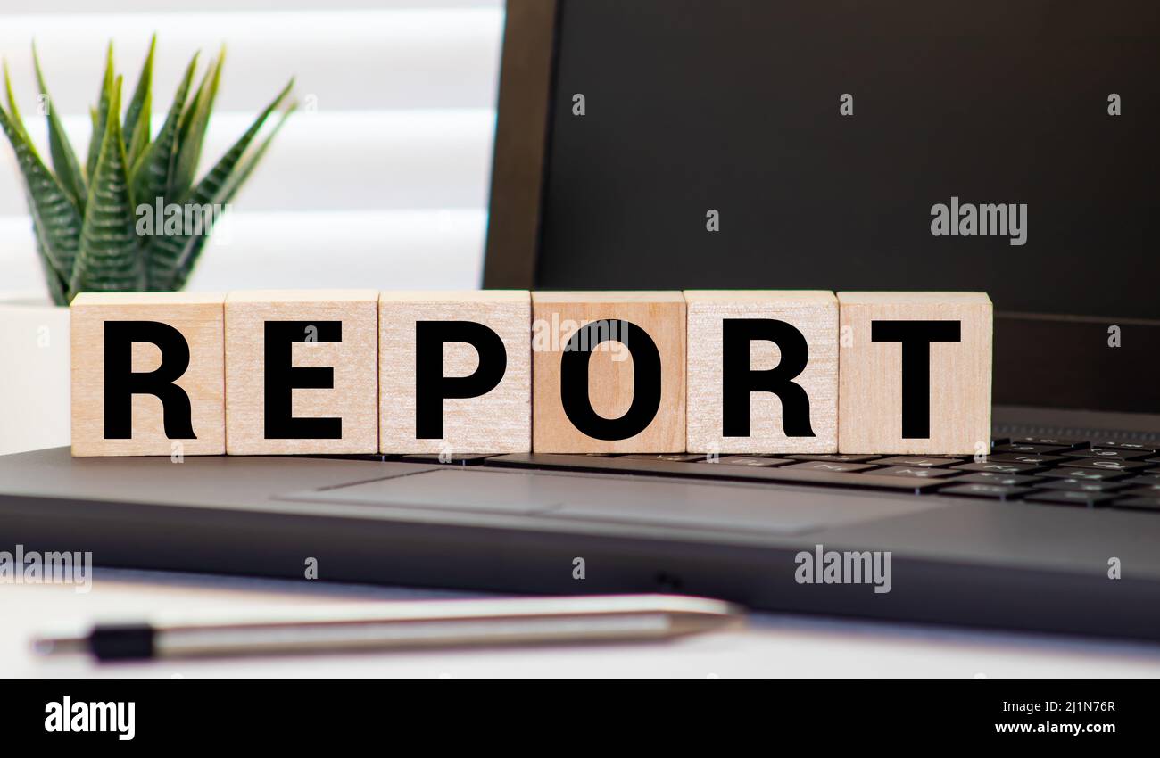 REPORTS word written on wood block. REPORTS text on table, concept ...