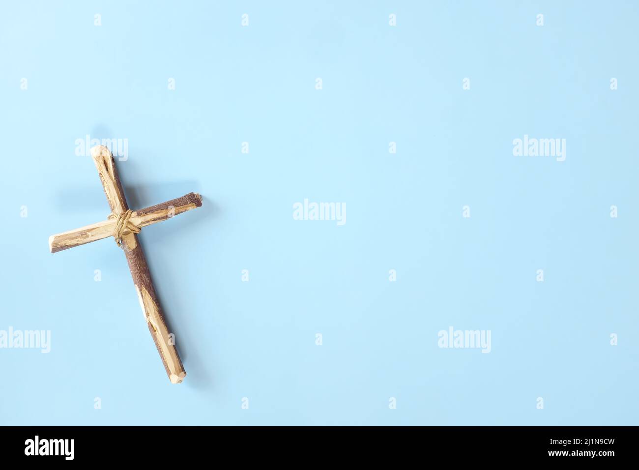 Top view flat lay of wooden cross crucifix with copy space. Catholicism ...