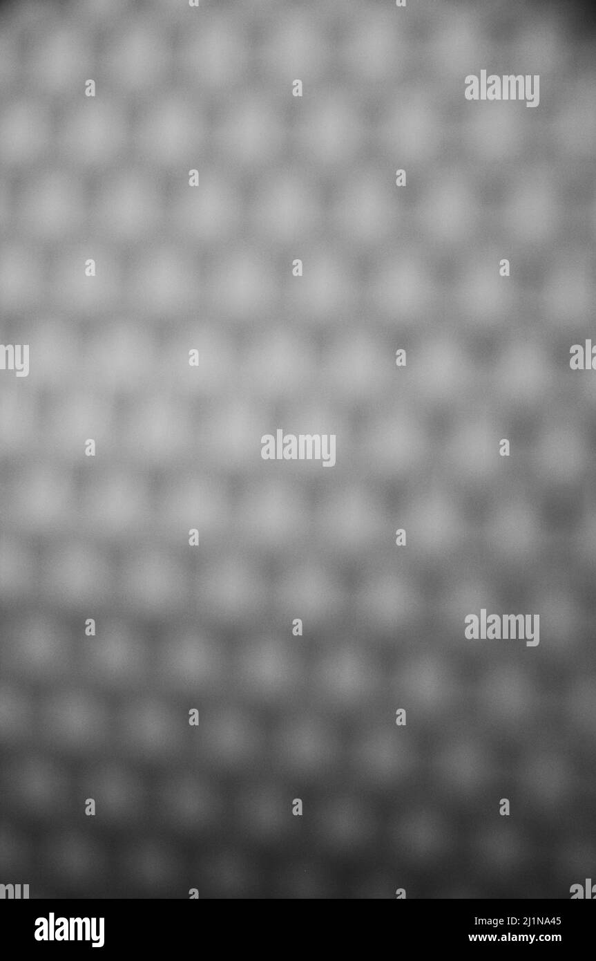 Dreamy blurry texture of a soft look at a regular wall with a repeating ...