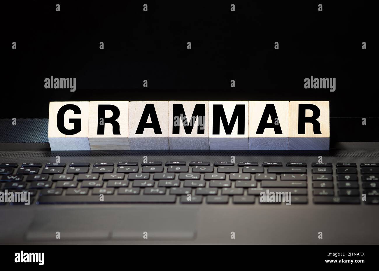 GRAMMAR text on a wooden background, concept Stock Photo - Alamy