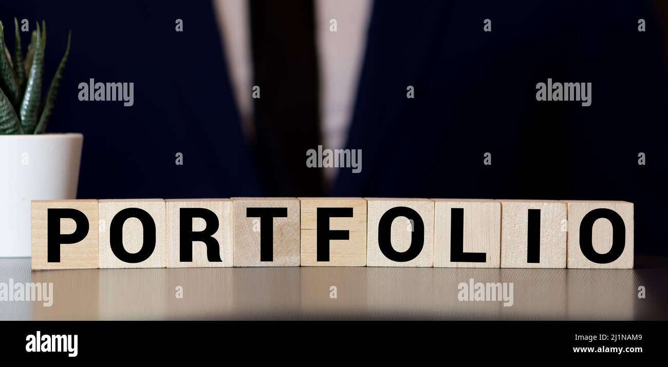 Portfolio word written on wood block, concept Stock Photo - Alamy