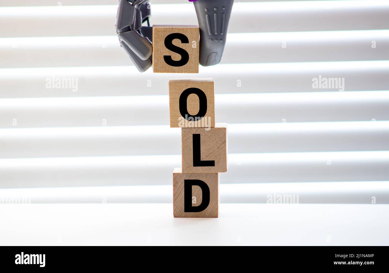 Sold Word Written In Wooden Cube, house concept Stock Photo - Alamy