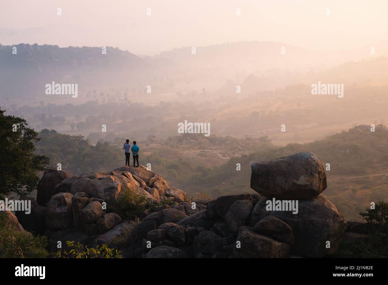 An aerial shot of a mountainous region with big rocks and cliffs with ...