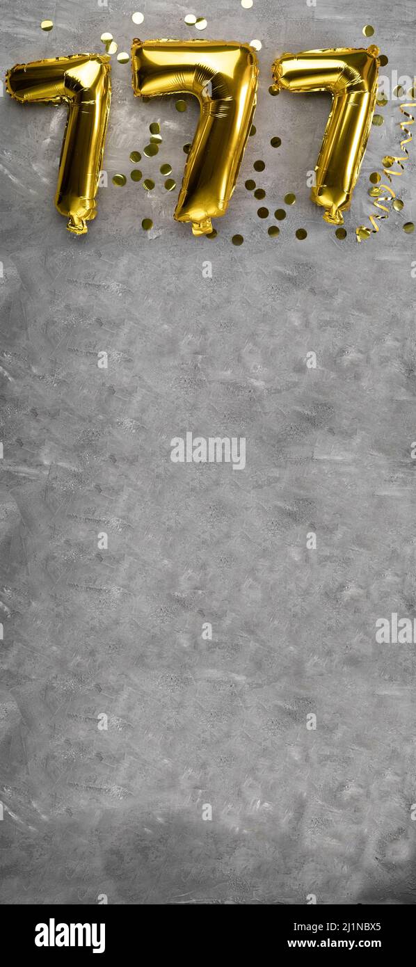 Lucky number seven on a concrete background. yellow balloons three ...