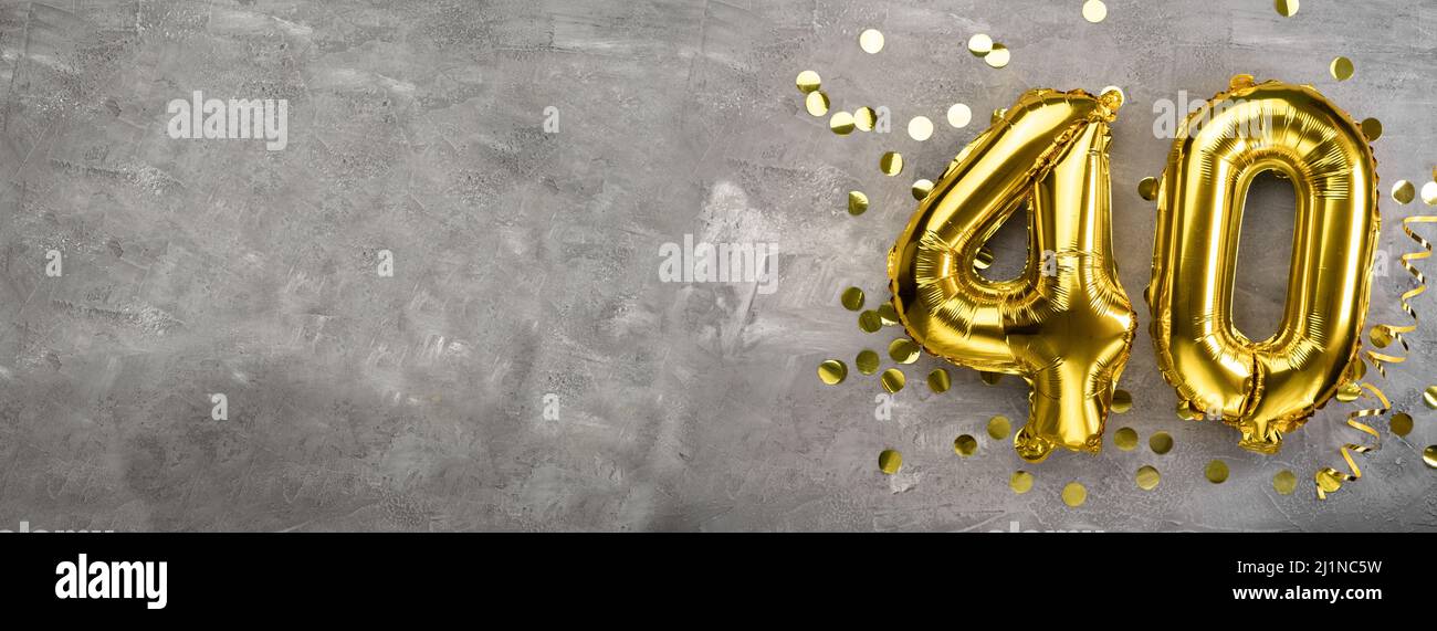 Yellow foil balloon number, number forty concrete background. Greeting ...