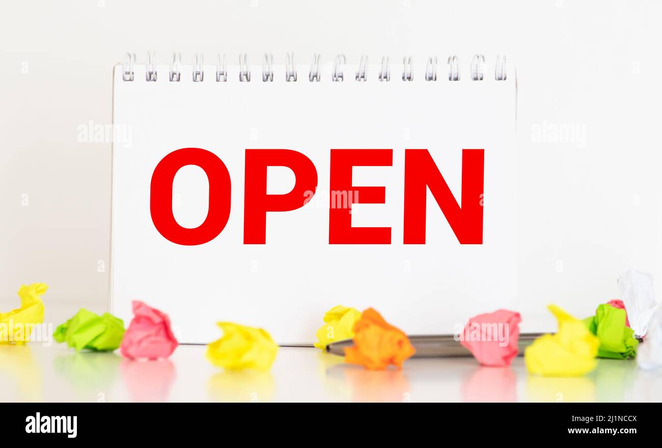 Open sign hanging in a shop window Stock Photo - Alamy