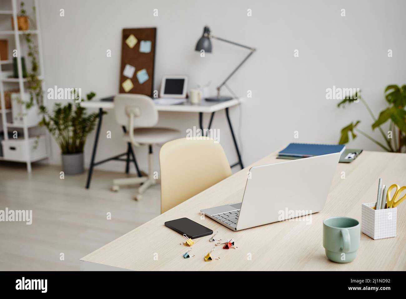 Background image of opened laptop on desk in comfortable office ...