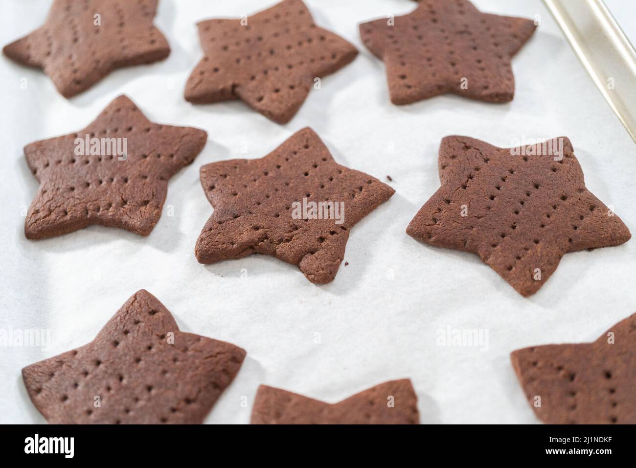 Cooling freshly star-shaped baked chocolate graham crackers on the ...