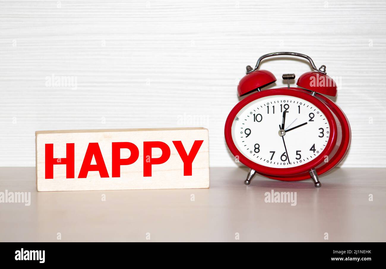 Happy Hours is written by cubes with letters with a black and white ...