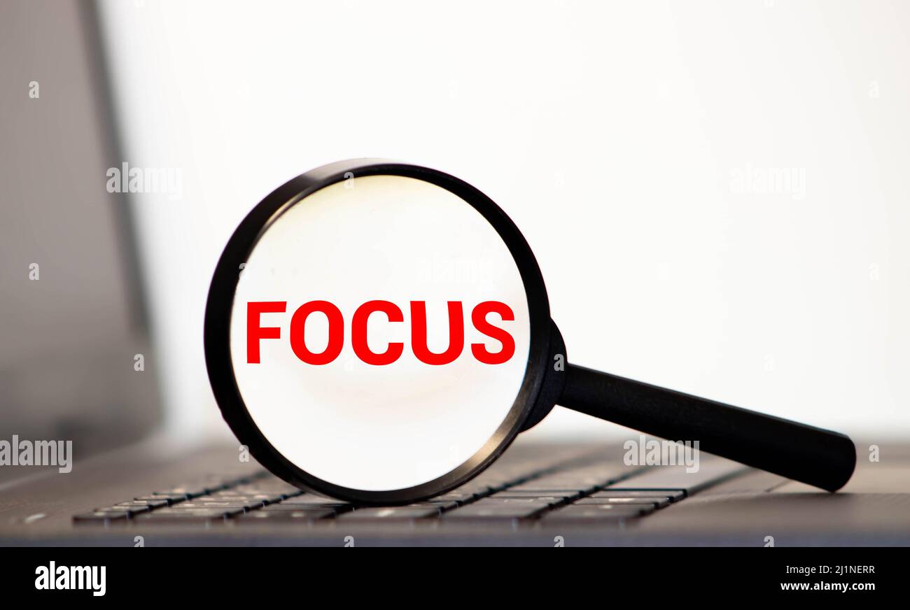 Focus word through a magnifying glass. Magnifying glass search concept ...