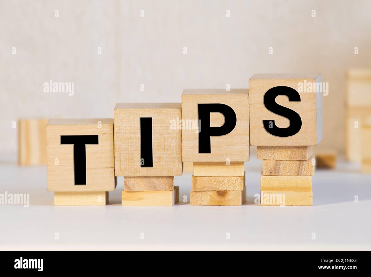 TIPS word written on wooden cubes, concept Stock Photo - Alamy