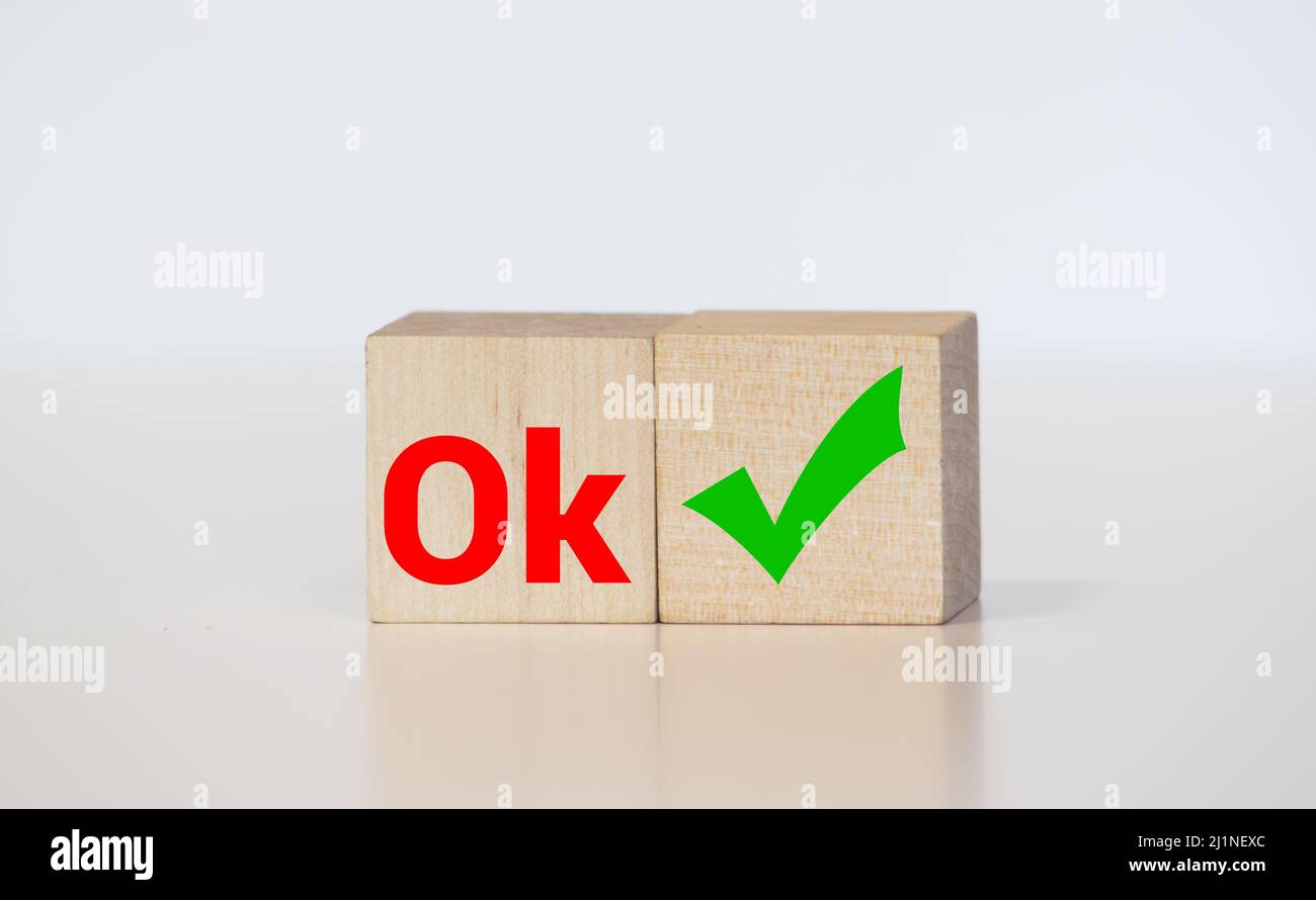 Word OK made with building blocks on white background with reflection ...