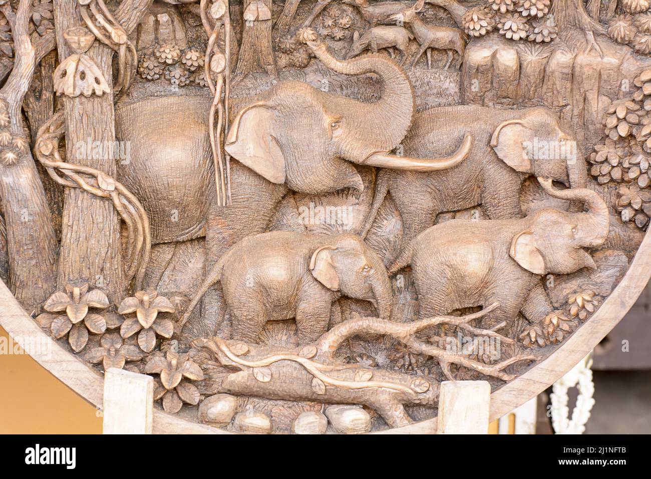 A closeup of wood carving of elephants Stock Photo - Alamy