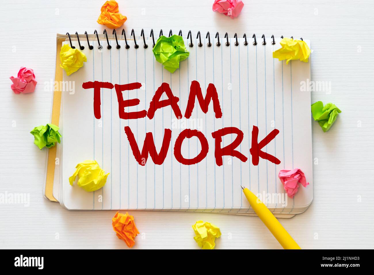 Team acronym and colored pencil on white background with word Together ...