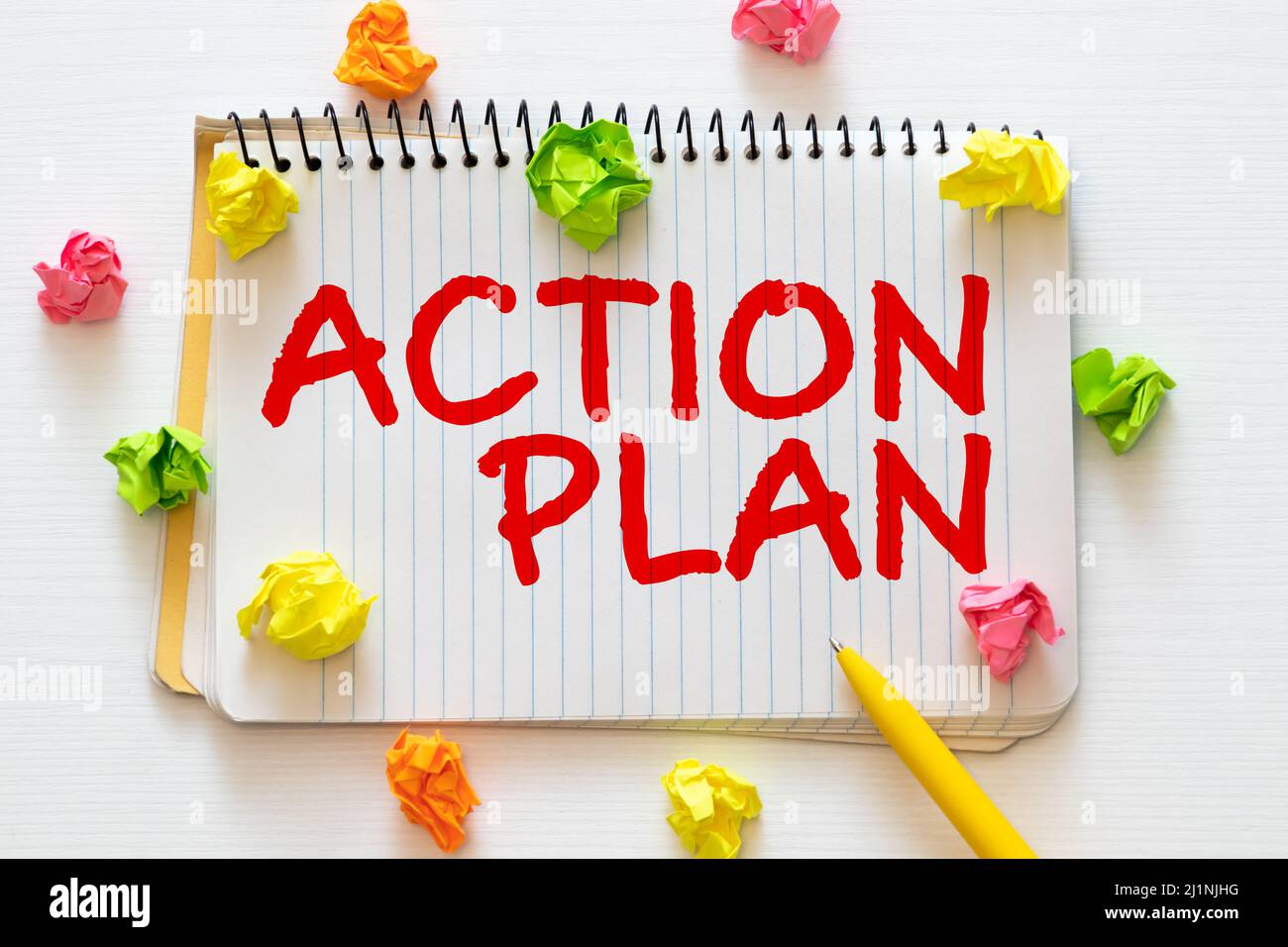 Action plan memo written on a notebook with pen Stock Photo - Alamy