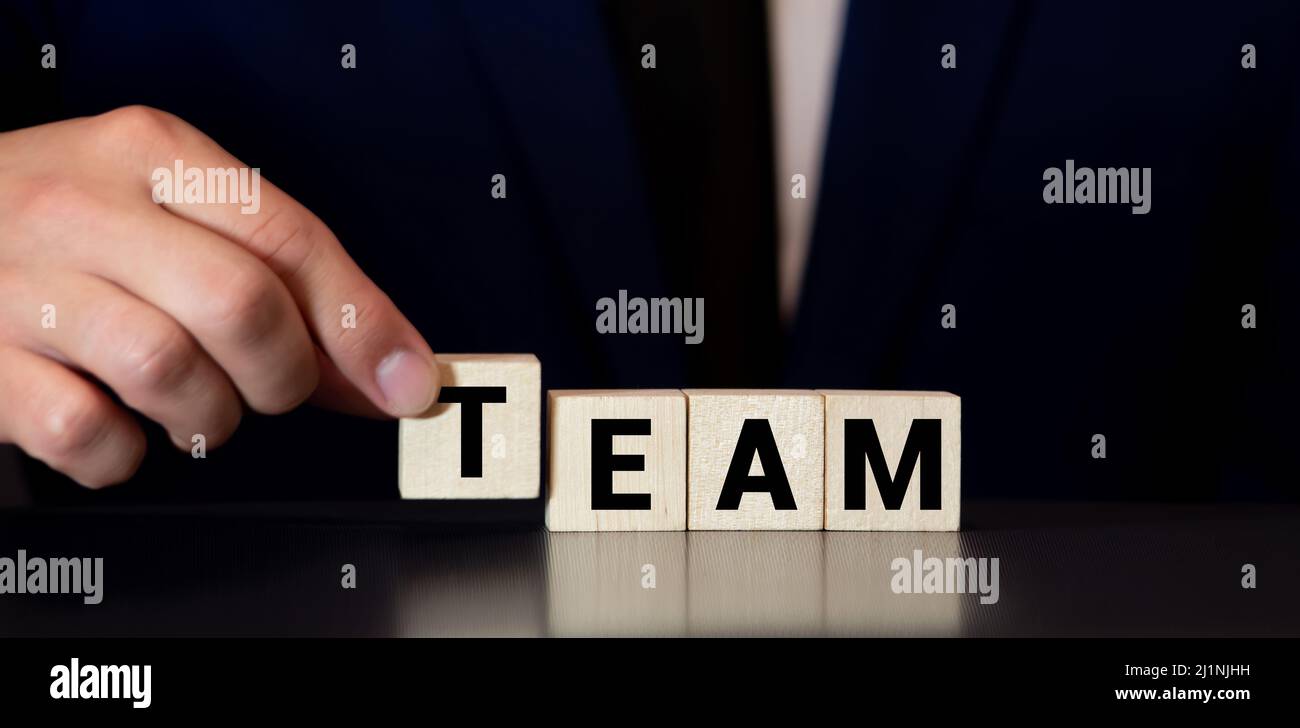 wood blocks with team word on white background Stock Photo - Alamy