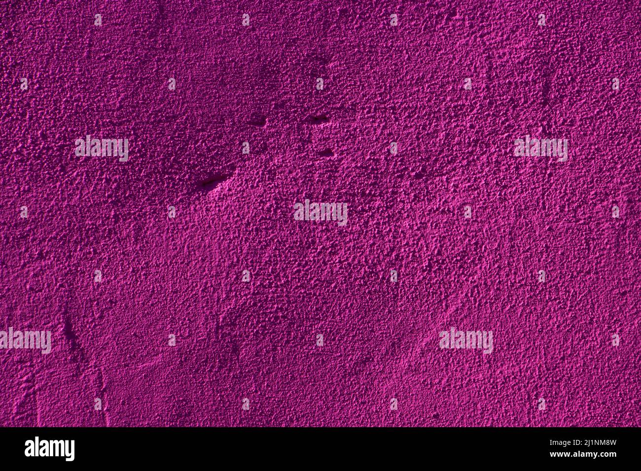 Magenta colored wall texture background with textures of different ...