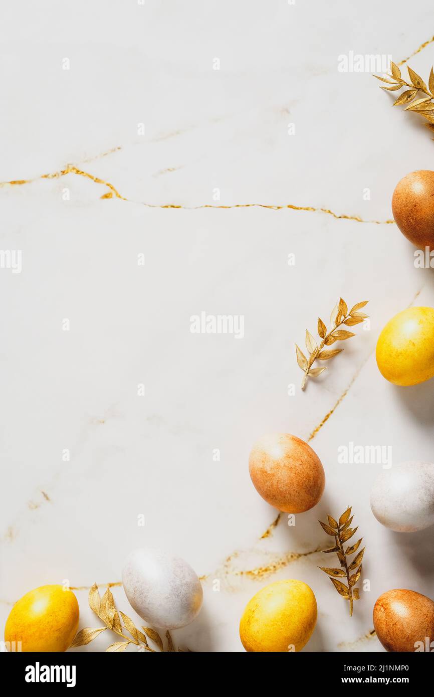 Elegant Easter vertical flat lay composition. Luxury Easter eggs with ...