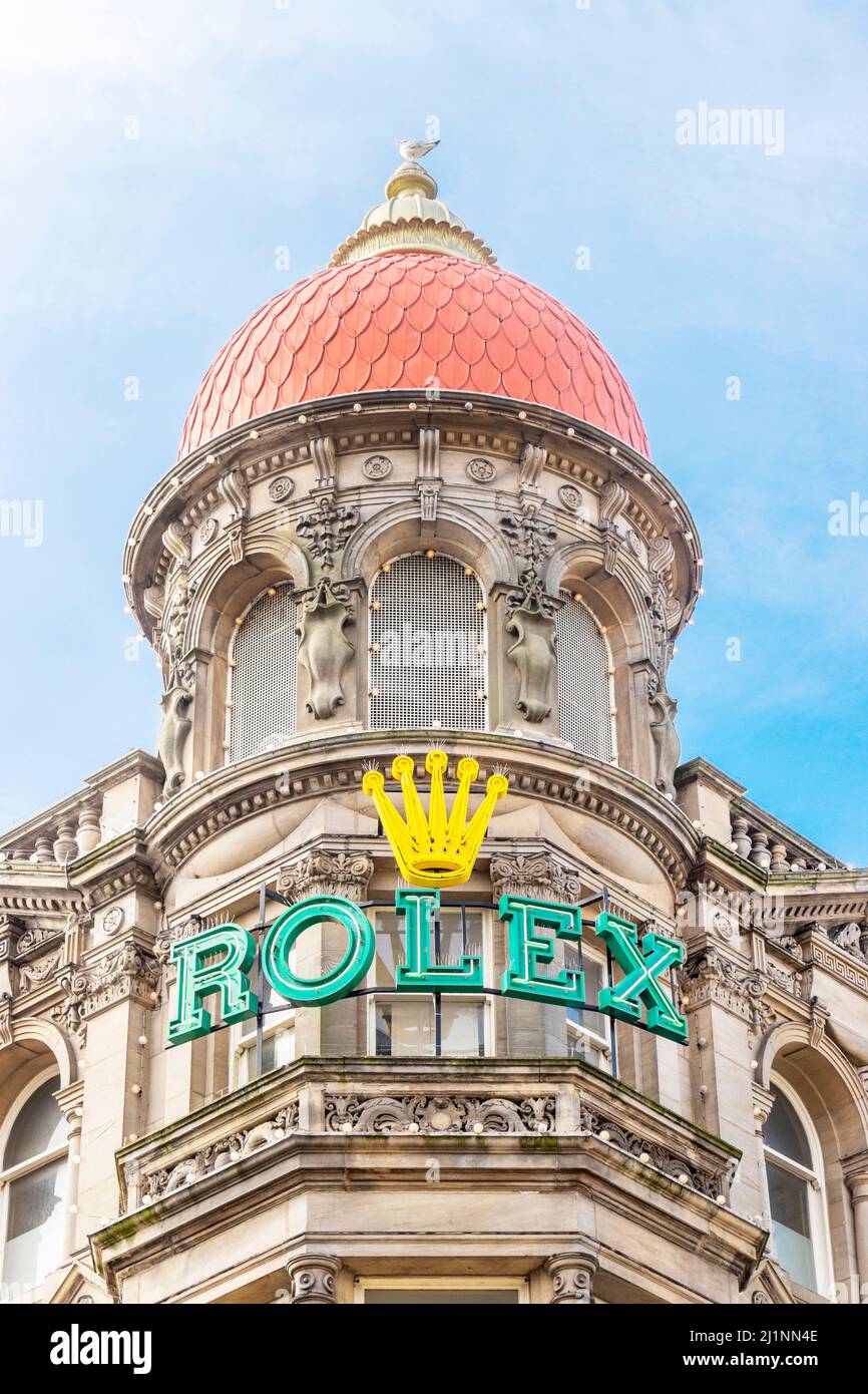 Rolex sign and crown on domed tower of ornate Victorian Northern ...