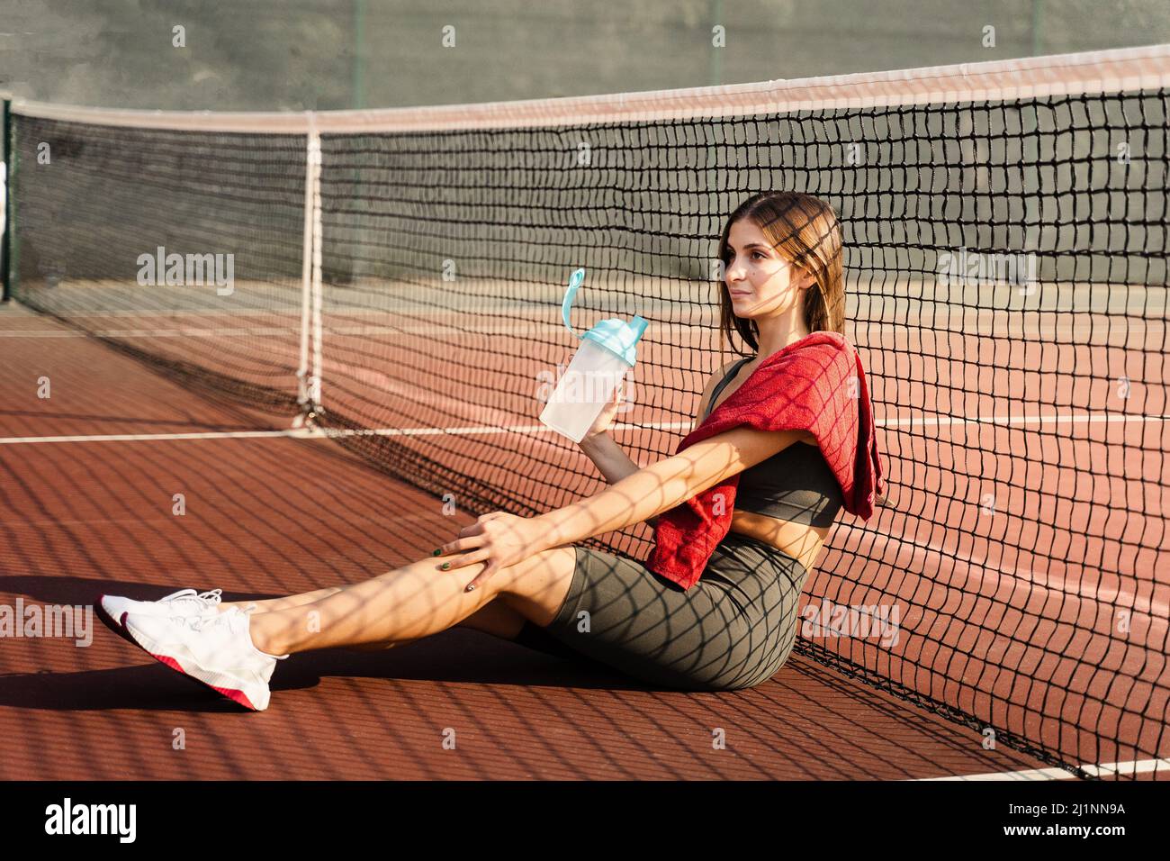 Athletic Fit Asian Girl Drinking Water From A Bottle Rest After
