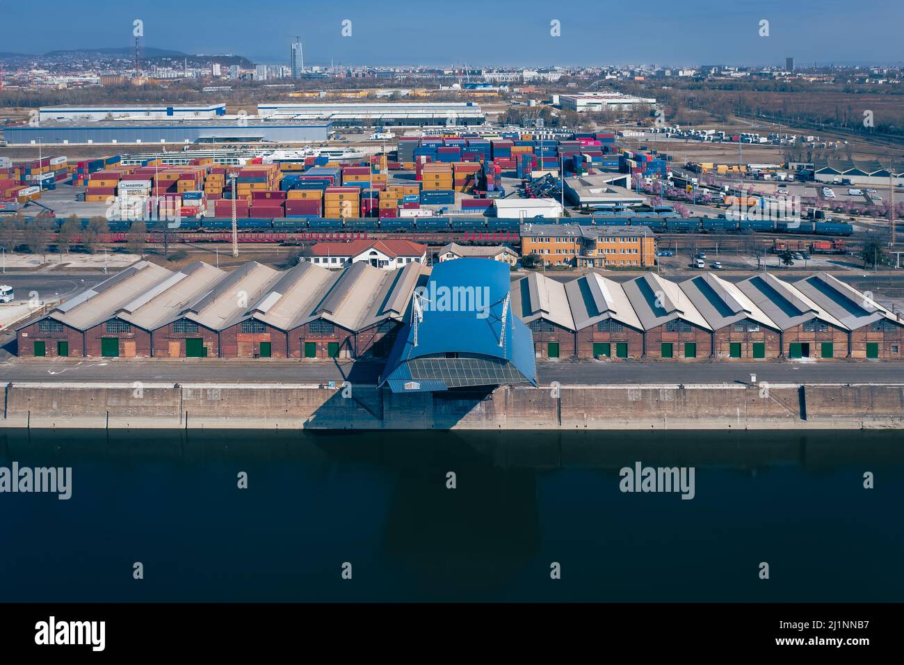 industrial port with containers in Danube river. Many much cargo waitng ...