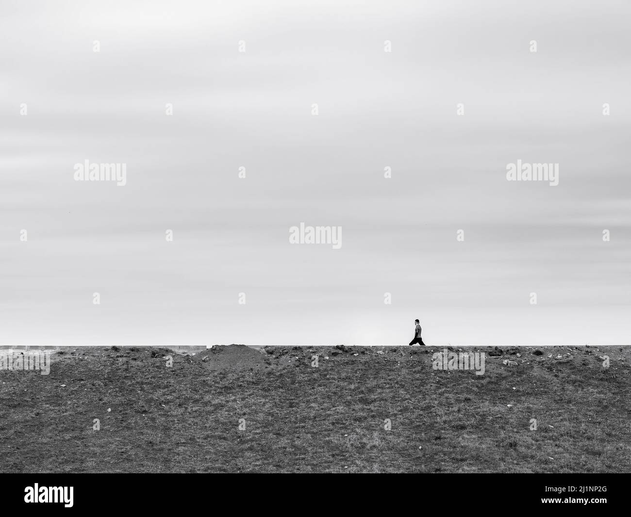 Black and white minimalist photo of man walking or working out Stock ...