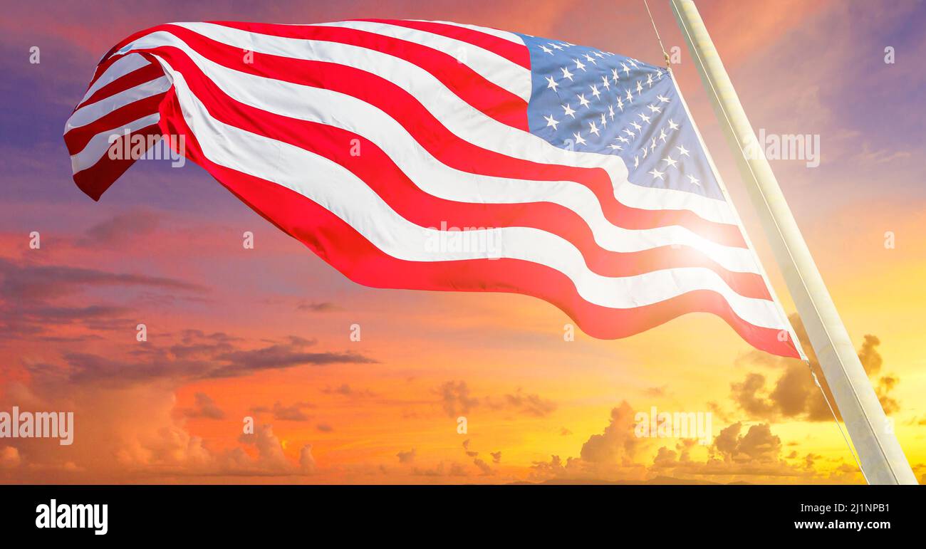 American flag raising with sunset on background United States National ...