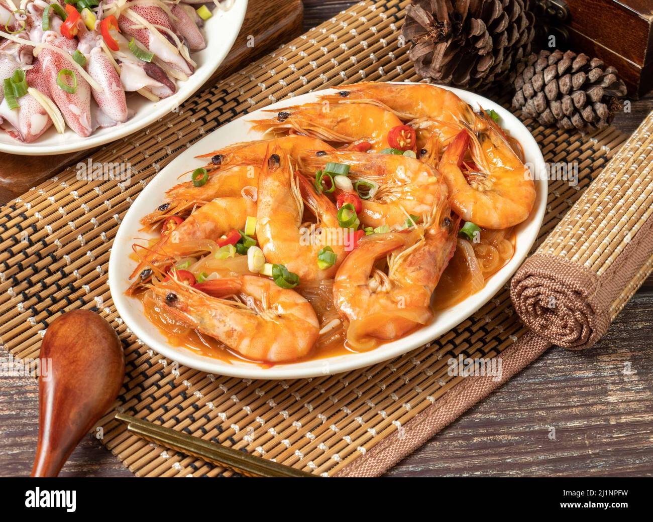 deep-fried Shrimp in a dish isolated on mat side view on dark wooden ...