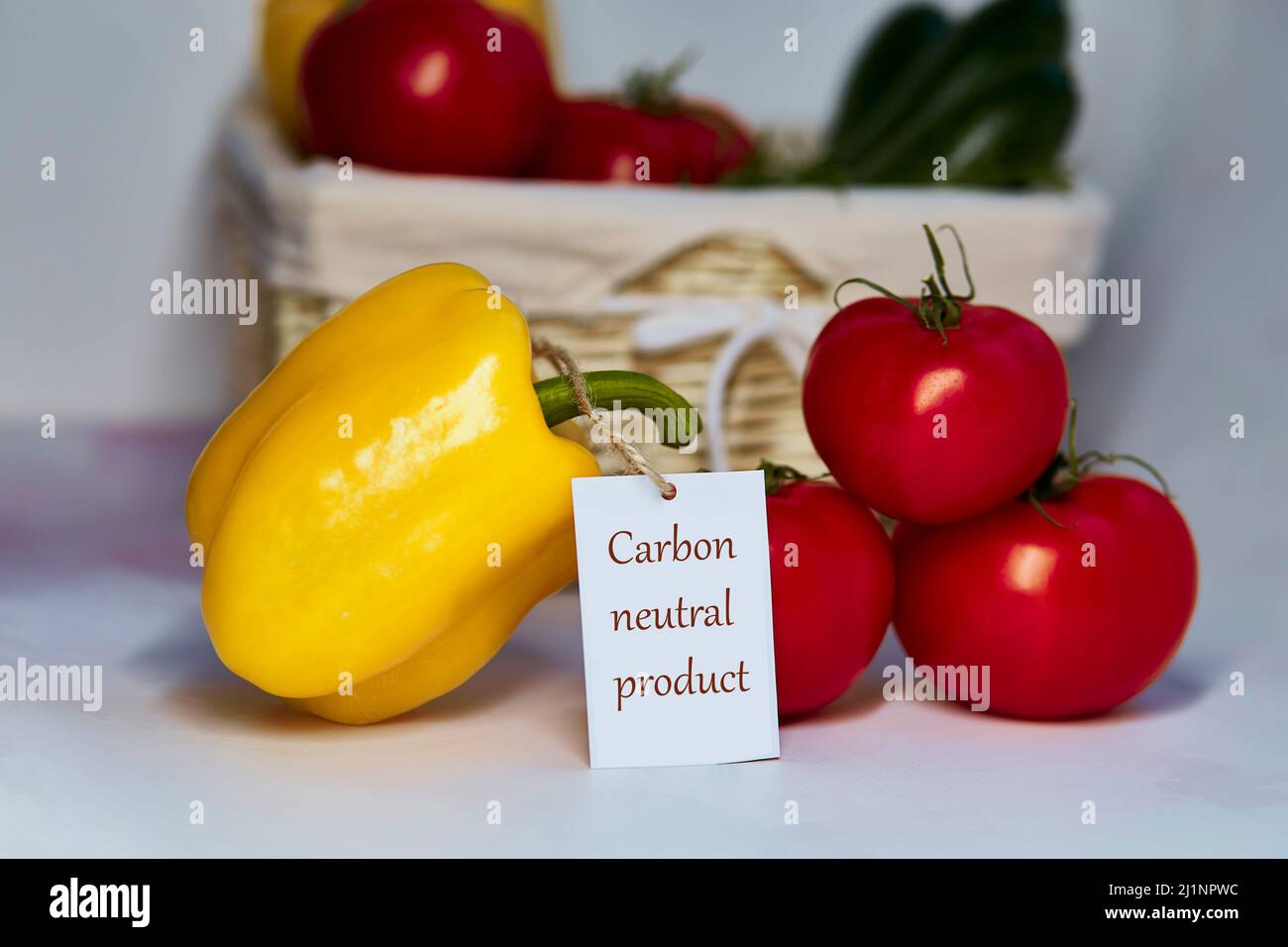 Carbon neutral product label on tomatoes and yellow bell pepper. Carbon ...