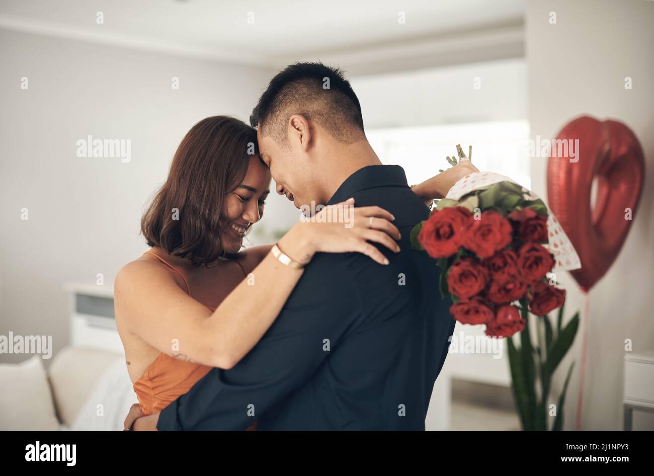 Young woman surprising husband gift hi-res stock photography and images ...