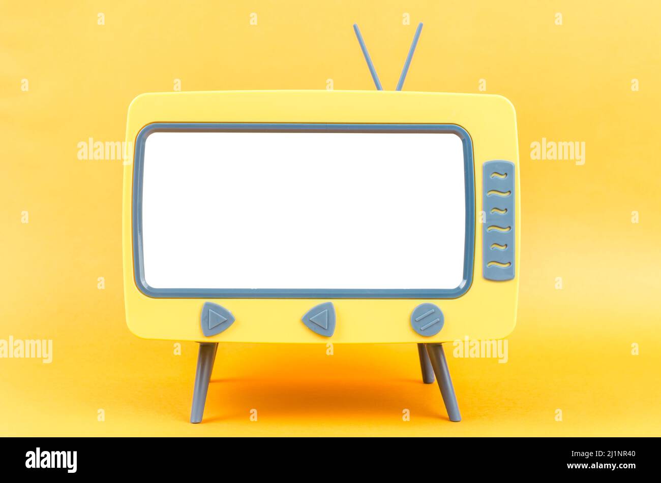The Vintage Miniature Toy Television on yellow background Stock Photo ...