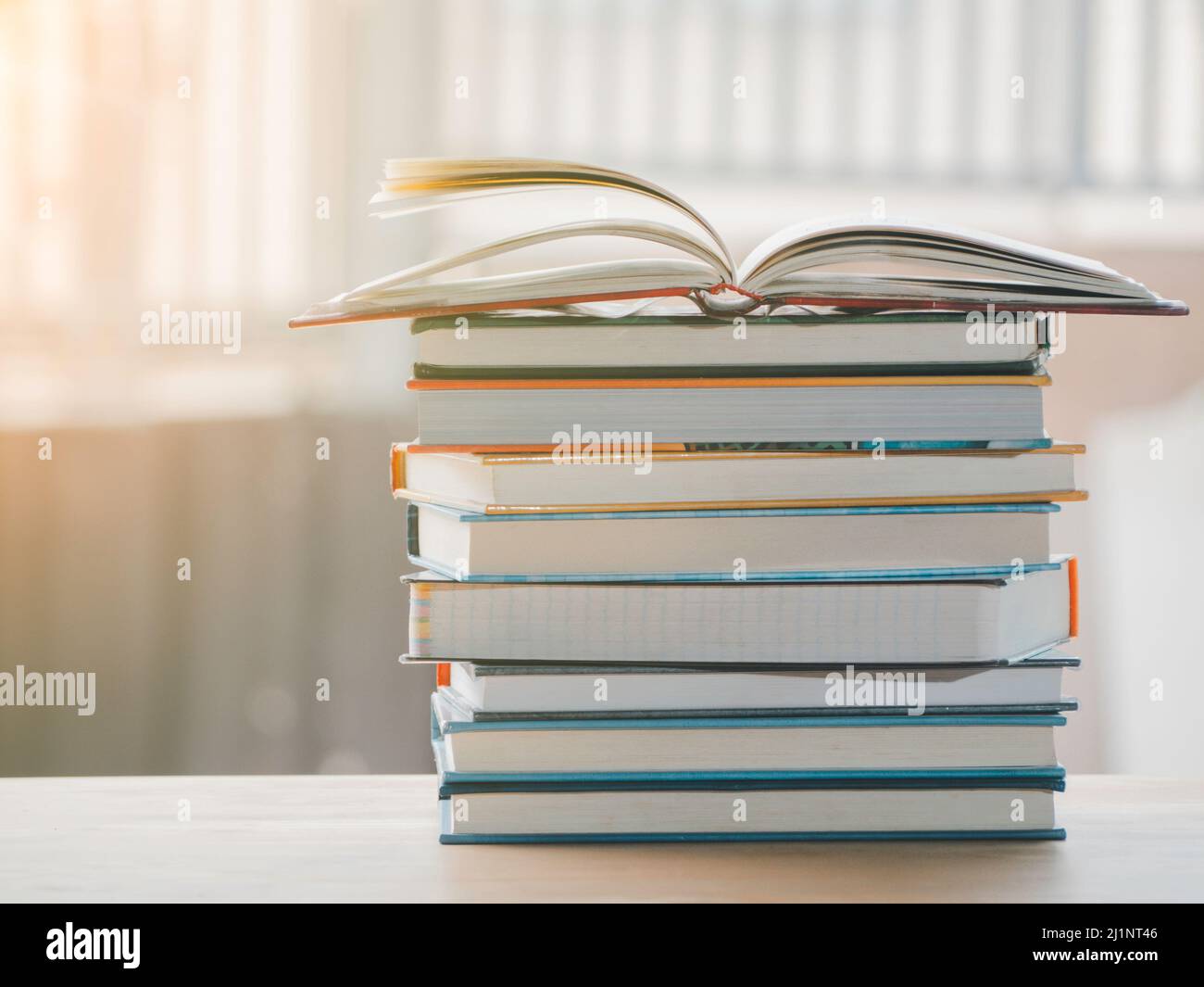 A simple composition of many books, stack or pile of books on wooden ...