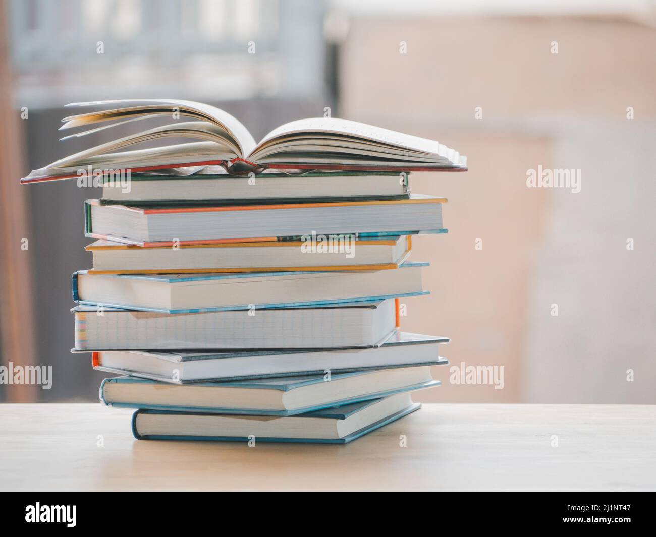 A simple composition of many books, stack or pile of books on wooden ...