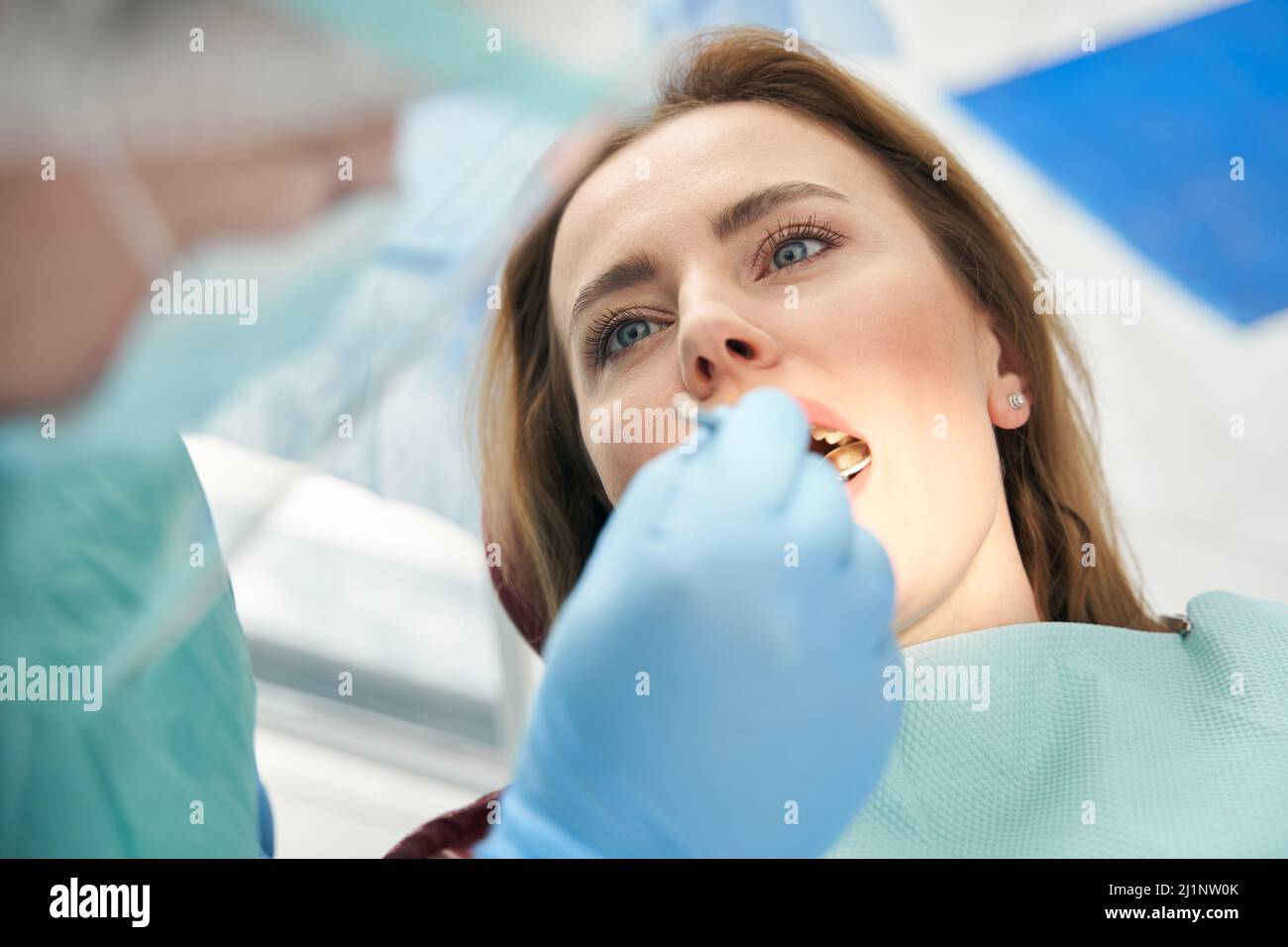 Doctor examining woman teeth in dental clinic Stock Photo - Alamy