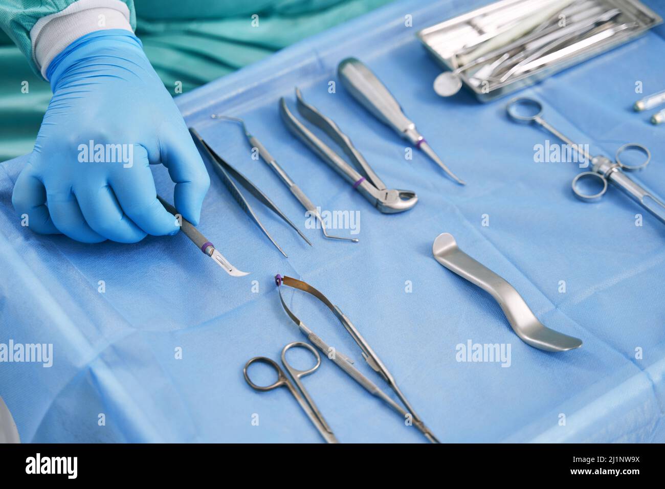 Dentist hand taking instrument for dental treatment Stock Photo - Alamy