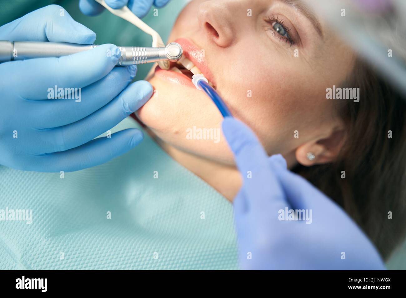 Dentist performing dental procedure with dental drill Stock Photo - Alamy