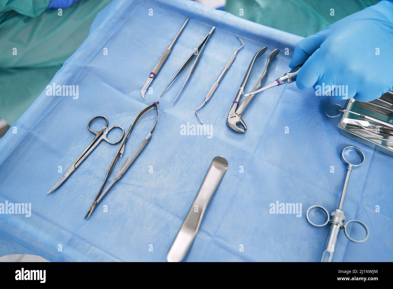 Doctor hand taking instrument for dental treatment Stock Photo - Alamy