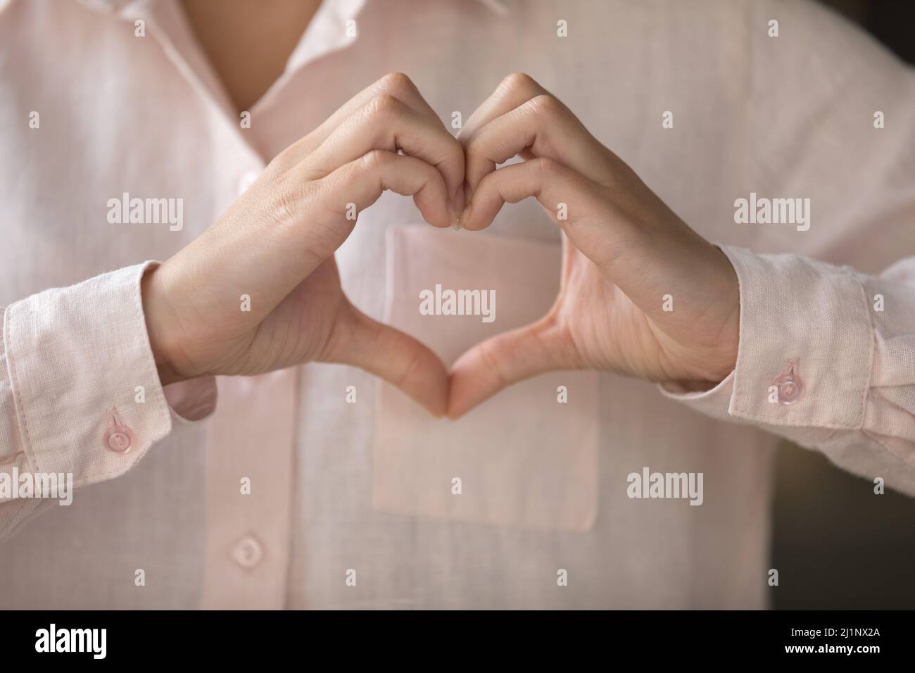 Woman joining hands hi-res stock photography and images - Alamy