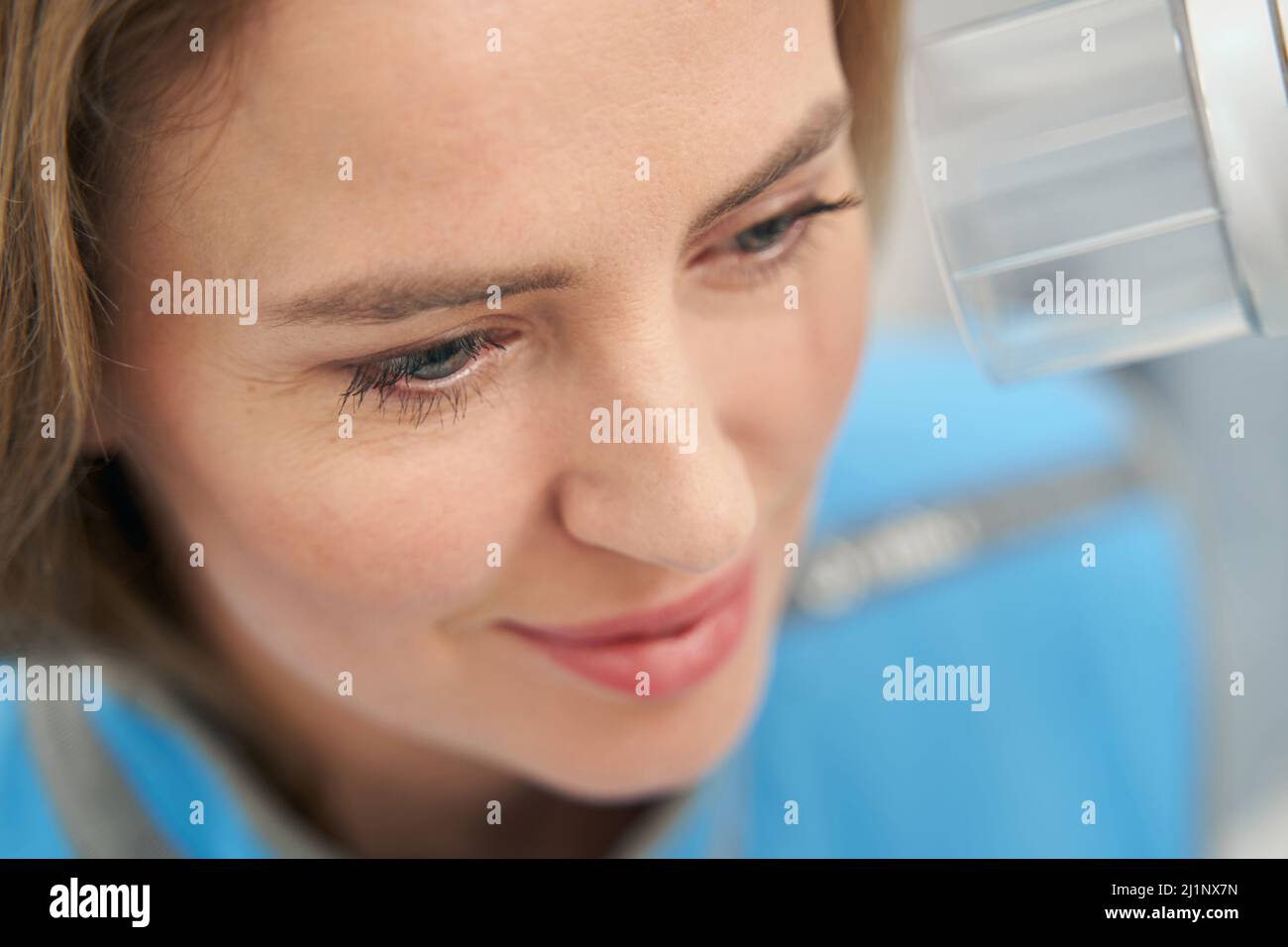 Woman using diagnostic scanning equipment in dental clinic Stock Photo ...
