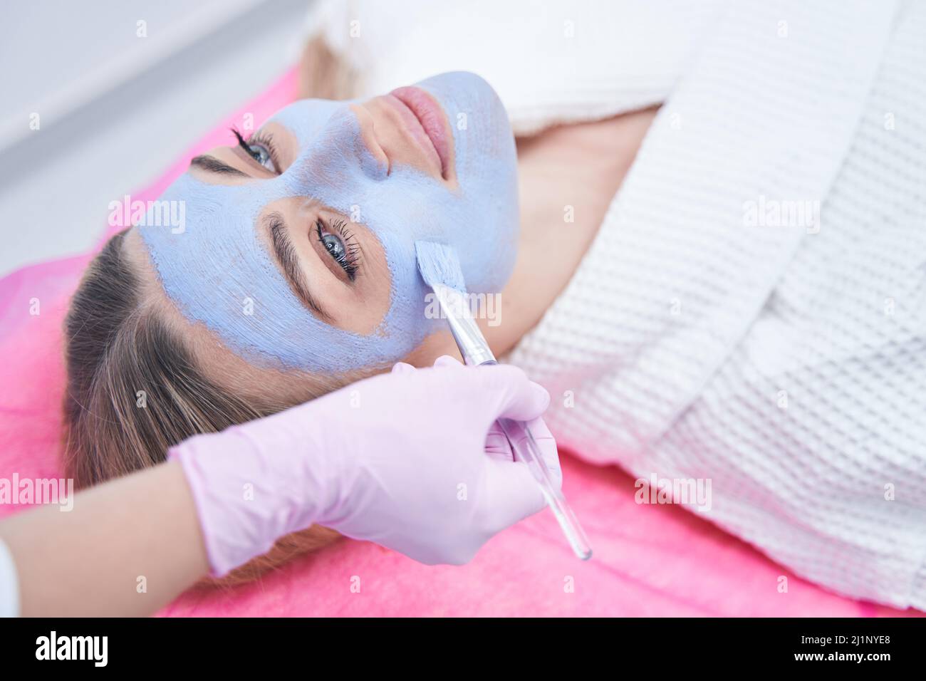 Close up gloved hand applying hi-res stock photography and images - Alamy