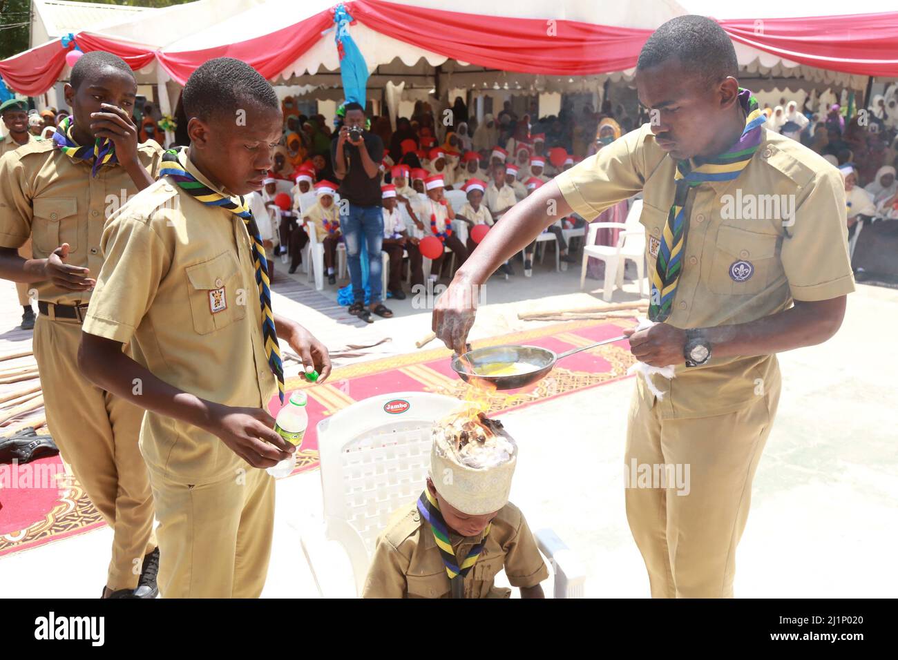 Young Scouts frying an egg on their partner's head. PHOTO BY MICHAEL ...