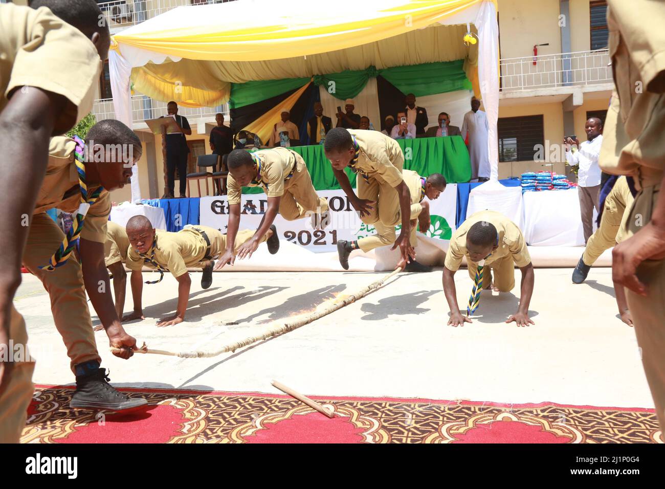 Young Scouts throwing a hot stick at a graduation ceremony in Dar es ...