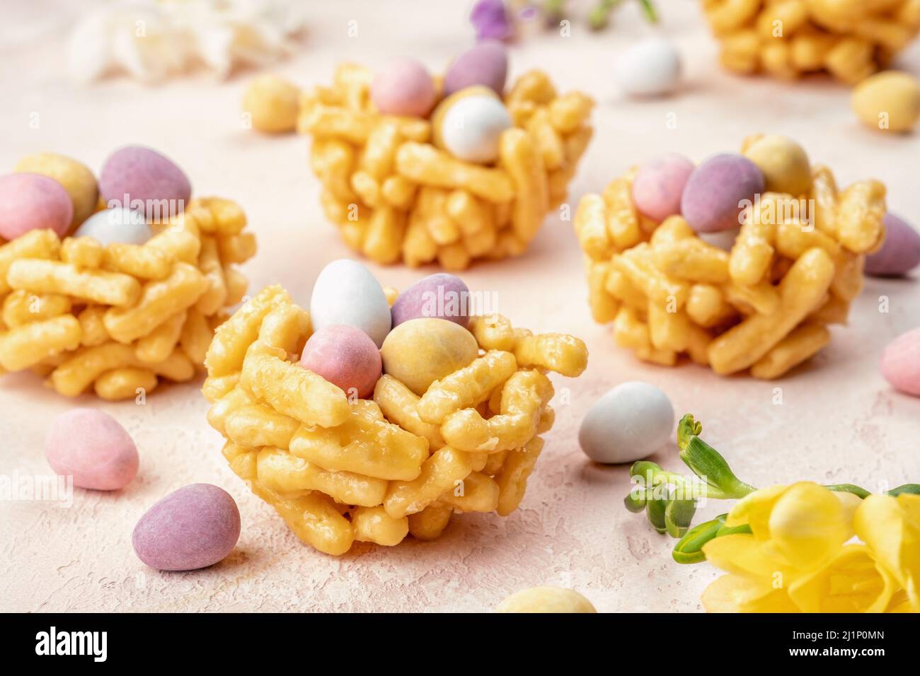 Springtime sweet nests filled with Easter eggs Stock Photo - Alamy