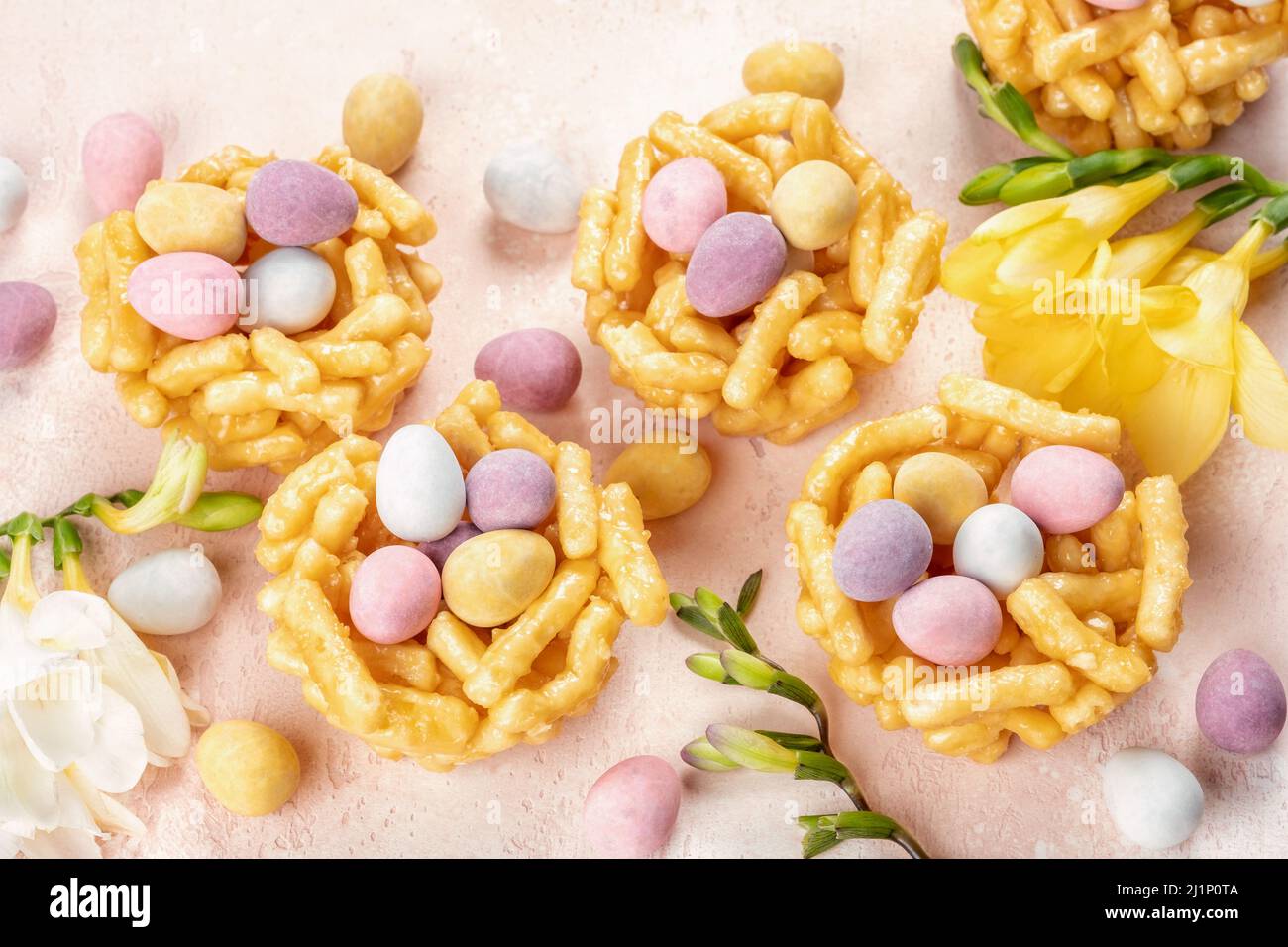Springtime sweet nests filled with Easter eggs Stock Photo - Alamy