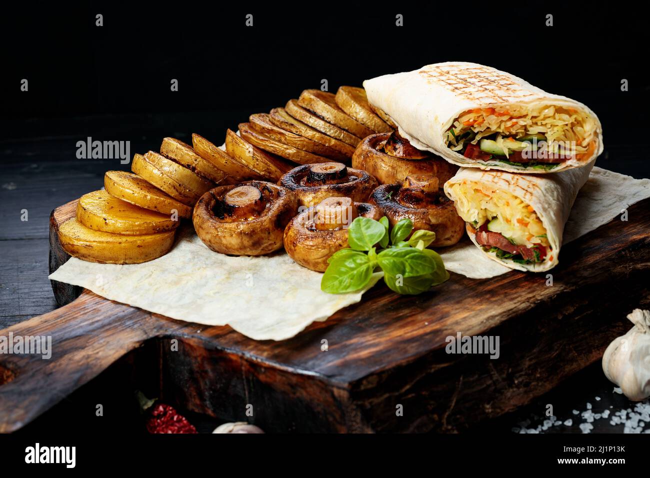 Traditional shawarma, fried potatoes and mushrooms. Turkish street food ...