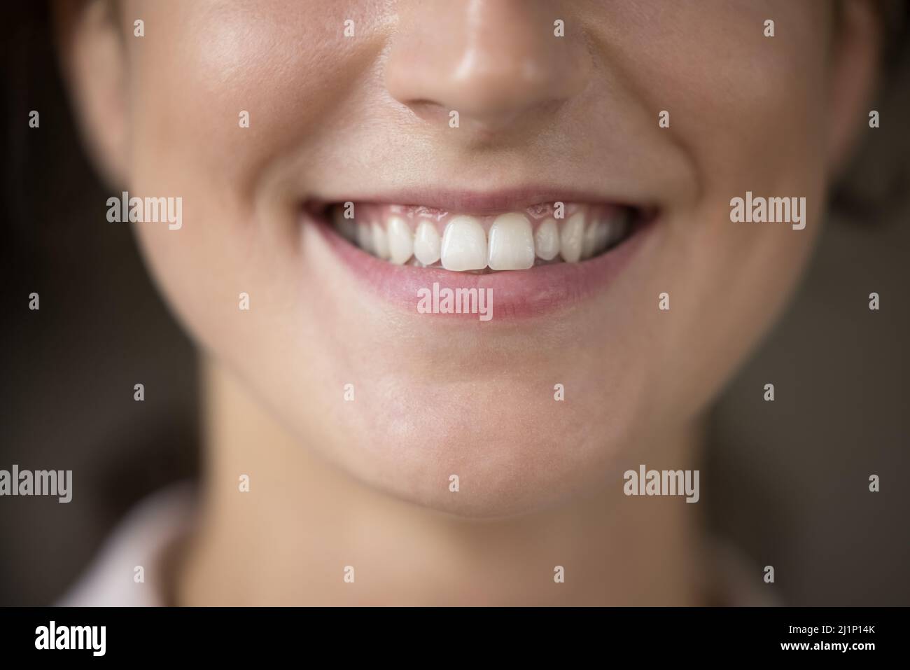 Happy young woman, girl with pretty toothy smile Stock Photo - Alamy