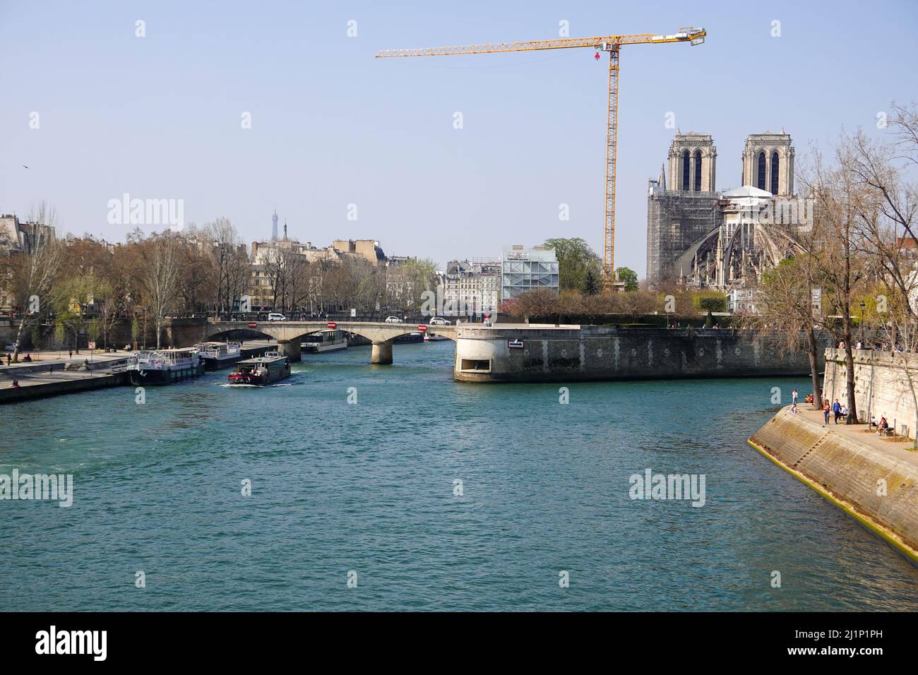 Facing West Towards Notre Dame Cathedral With Tall Crane As Part Of